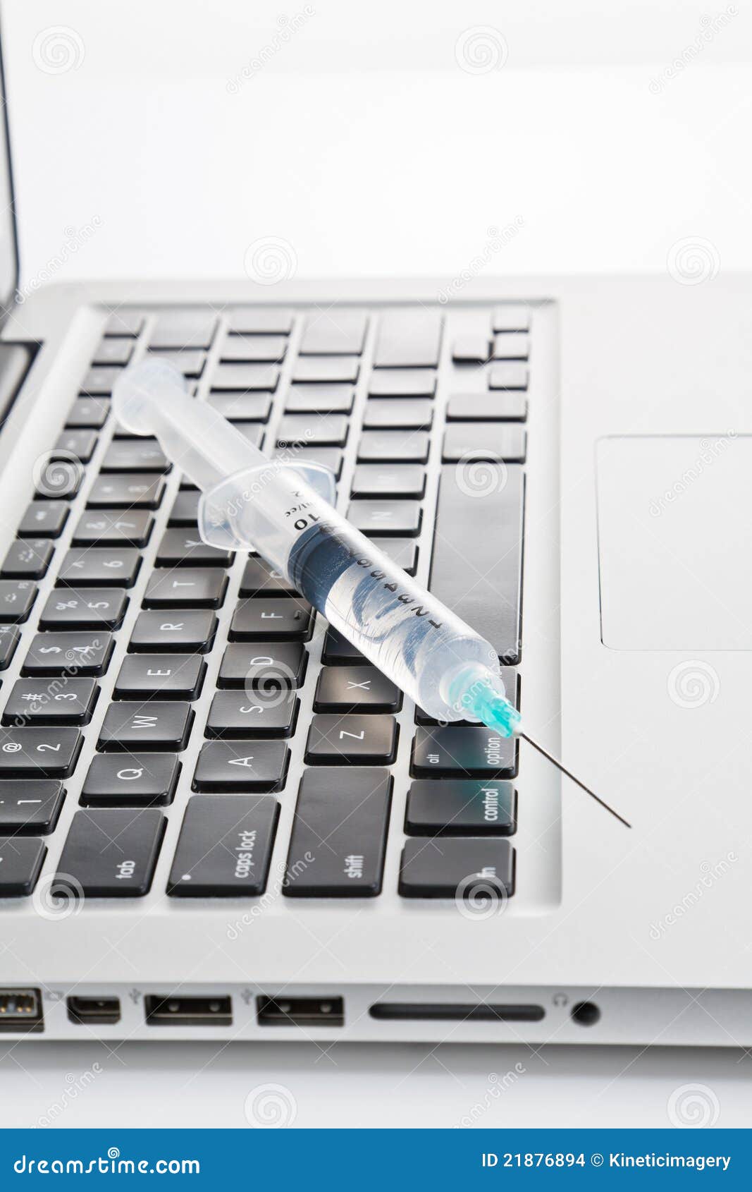 Syringes on a laptop stock photo. Image of drug, online - 21876894
