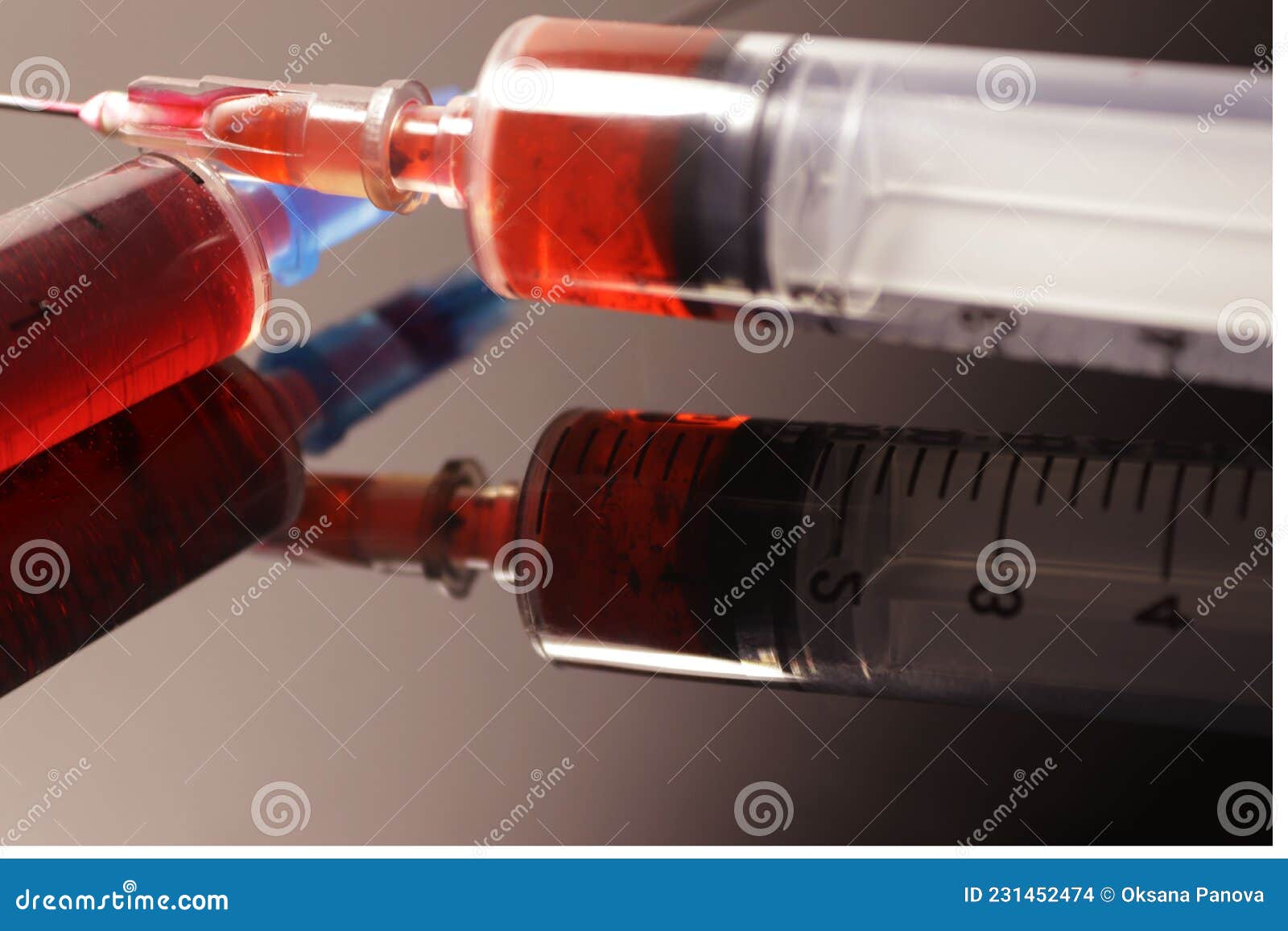 Syringes on a Mirrored Dark Background with Blood Stock Photo - Image ...