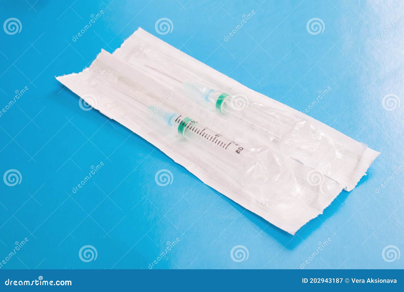 Syringes in a Package on Blue Background Stock Image - Image of ...