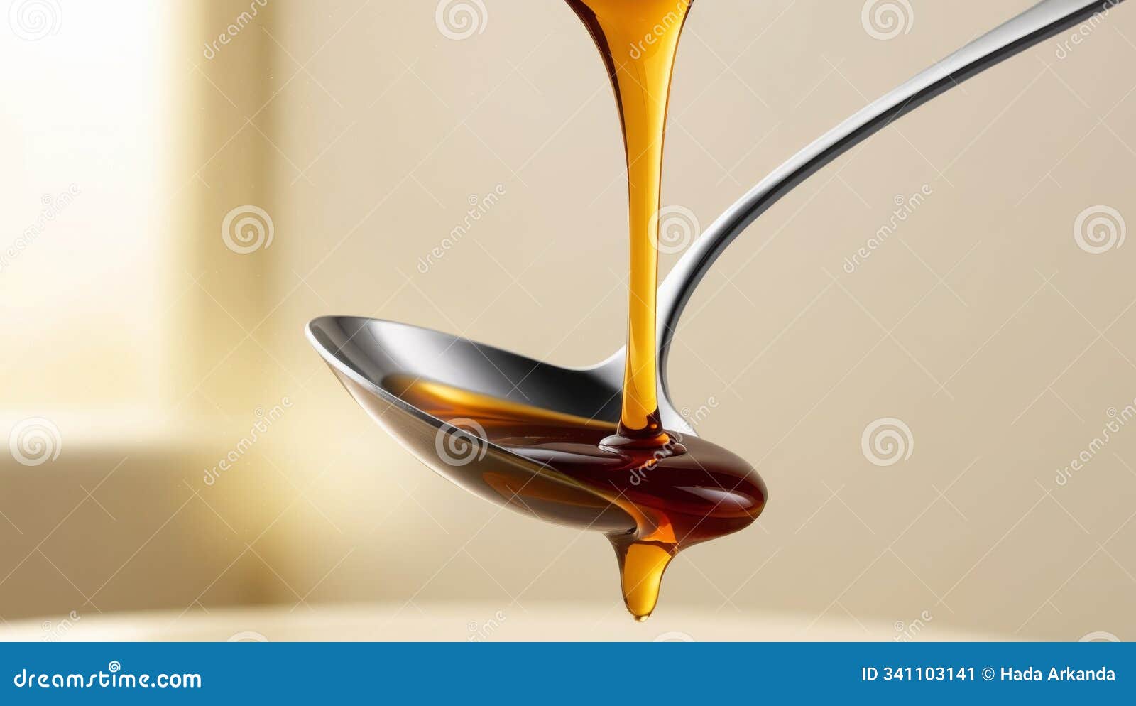 Syrup Dripping from a Spoon, with Thick Liquid Flowing Smoothly Stock ...