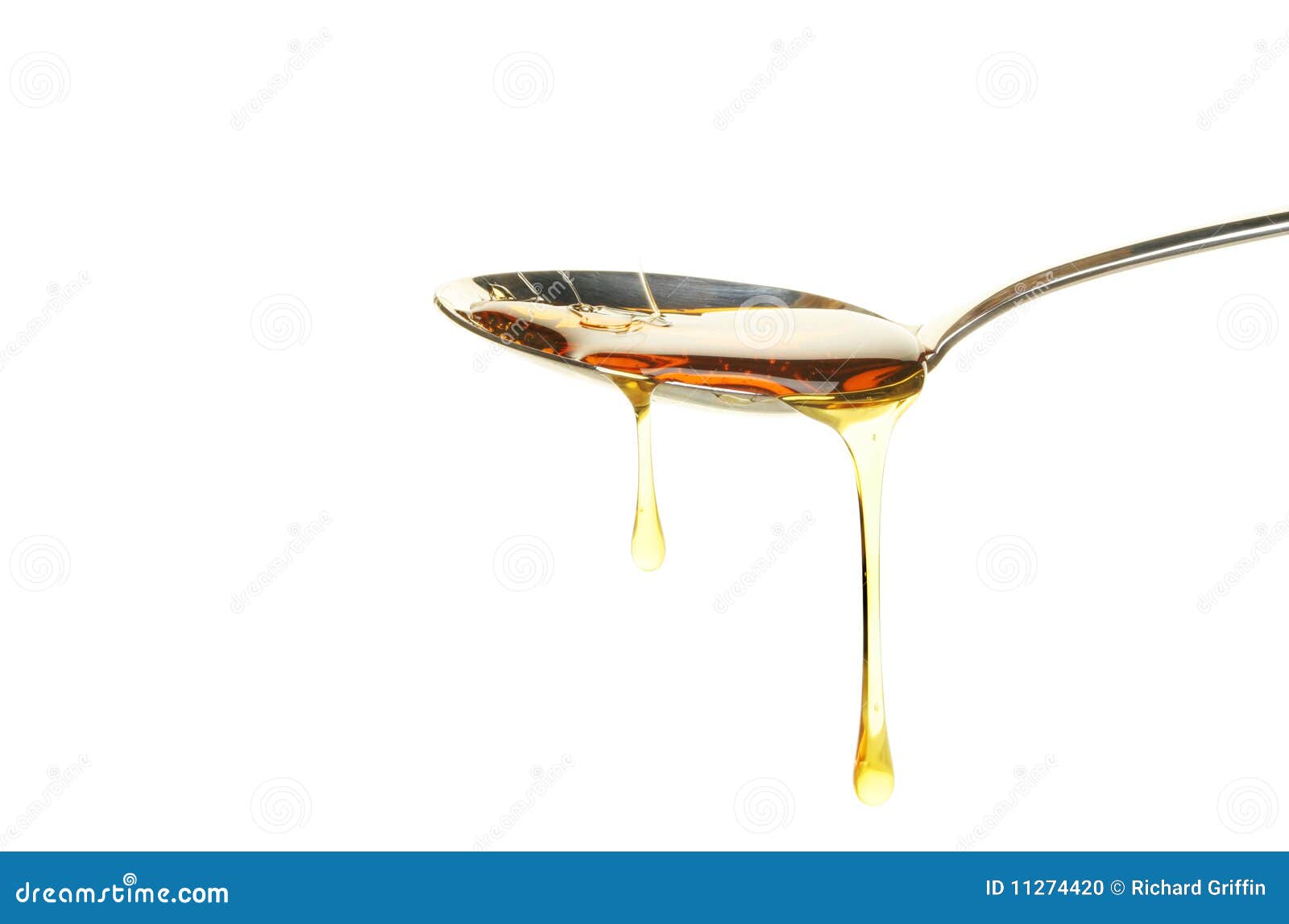 Syrup in spoon stock photo. Image of golden, drip, drop - 11274420