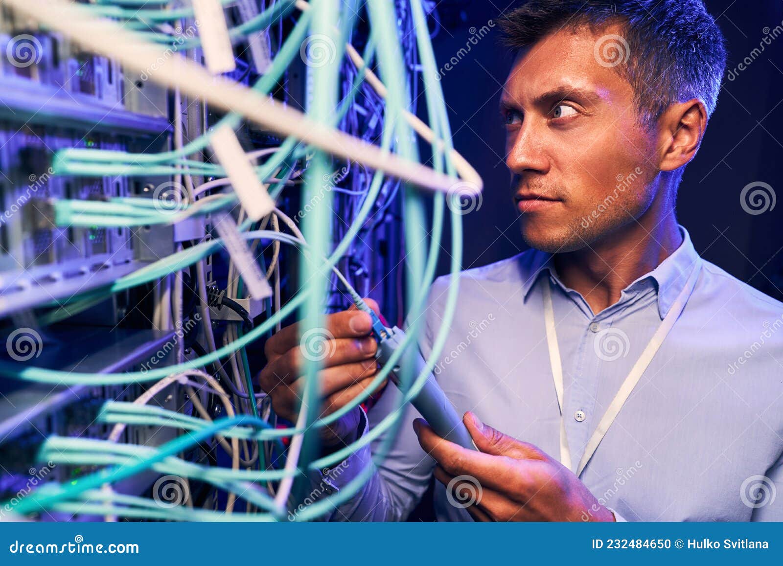 Sysadmin Doing Performance Testing of Network Cabling Stock Photo ...