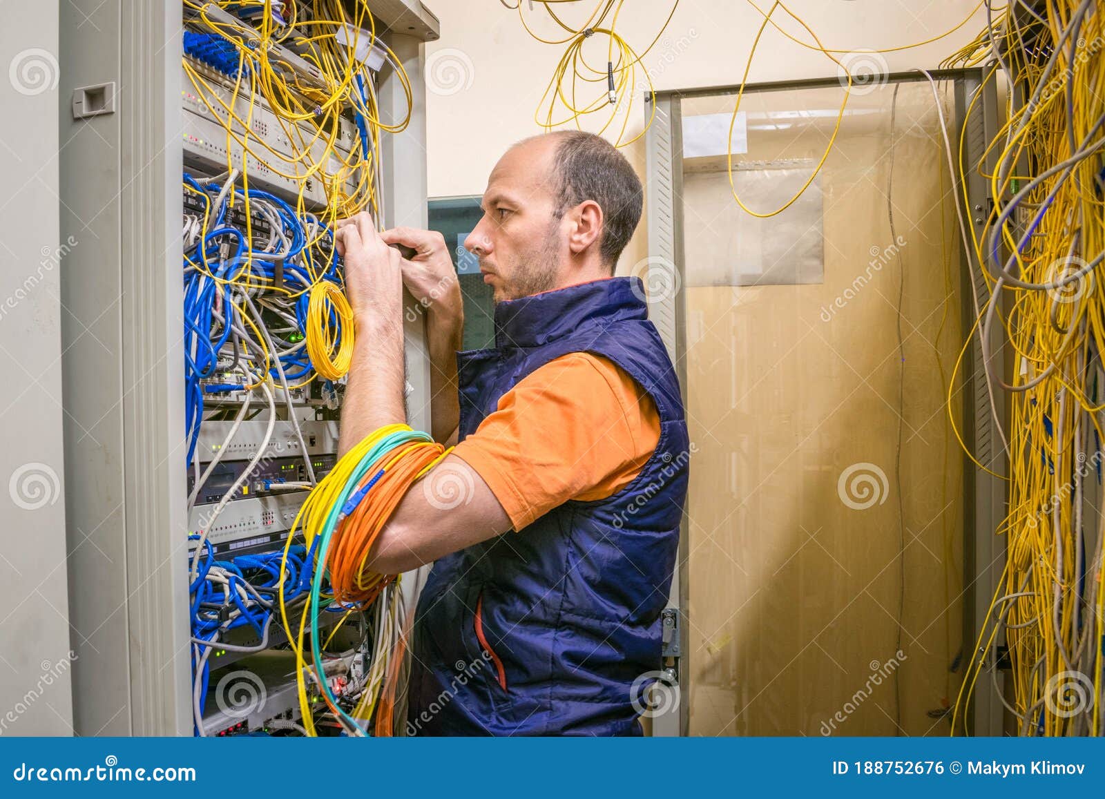 System Administrator Commutes Many Messy Wires in the Server Room ...