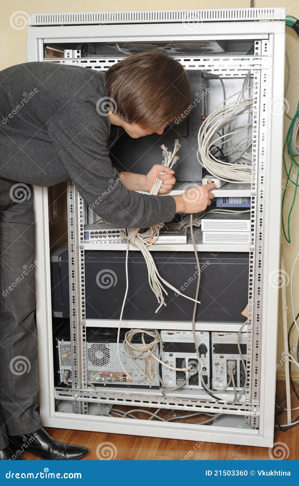System Administrator Near Server Stock Photo - Image of person ...