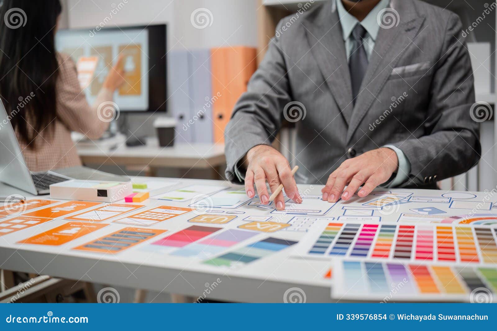 System Developer Analyzing UX UI Plans in Modern Office Setting with ...