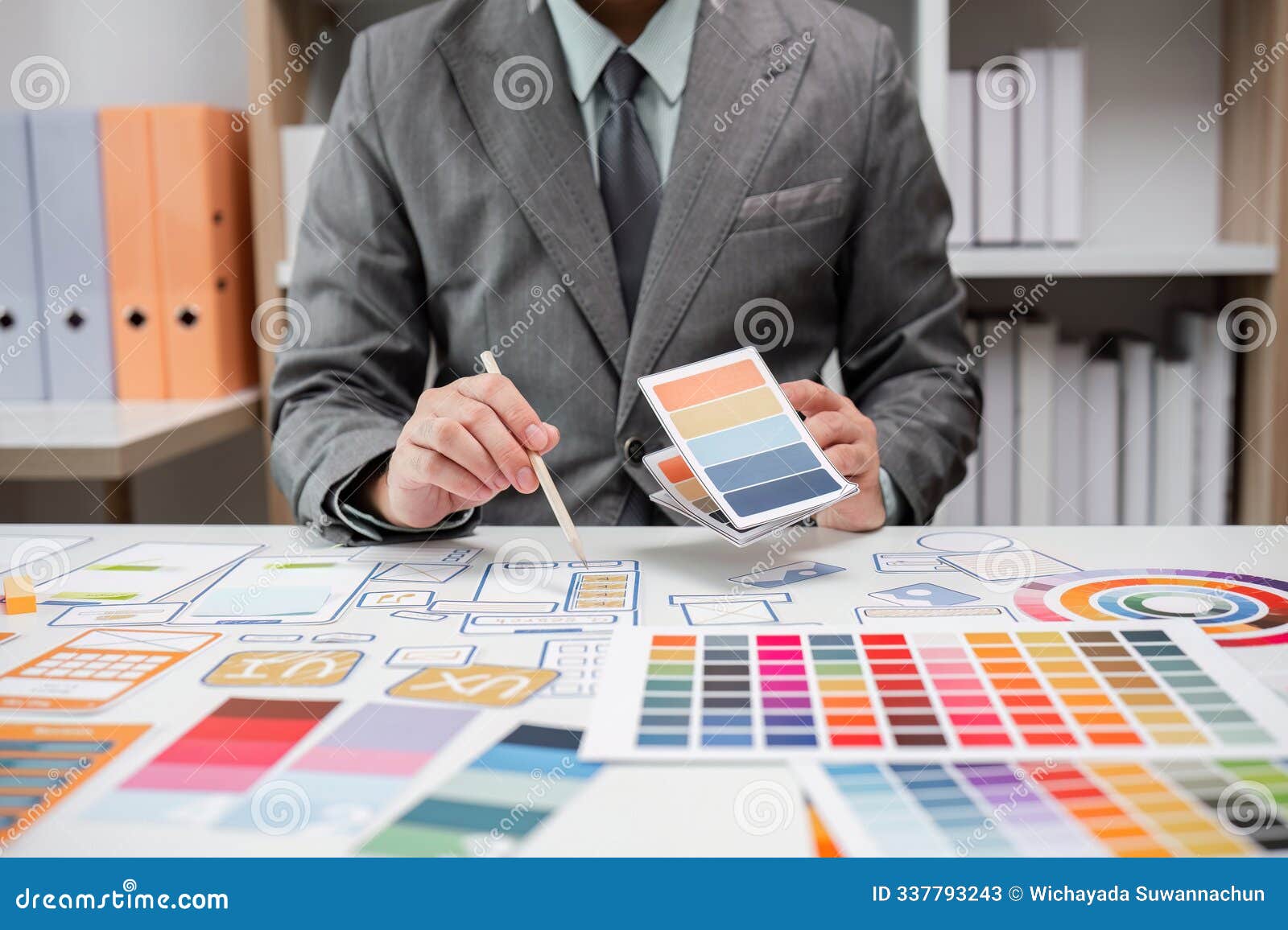 System Developer Analyzing UX UI Plans with Color Swatches and Design ...