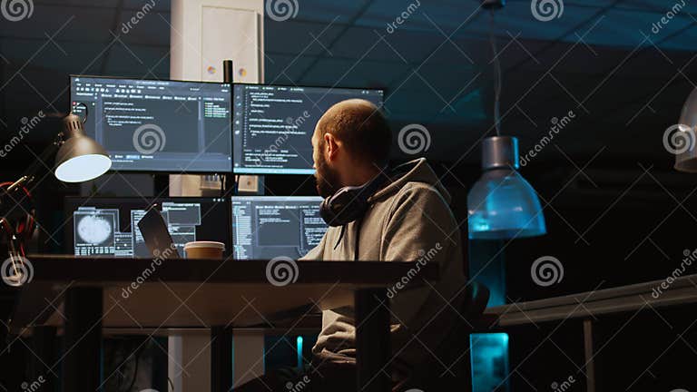 System Programmer Typing Source Code on Laptop and Multiple Monitors Stock Photo - Image of ...