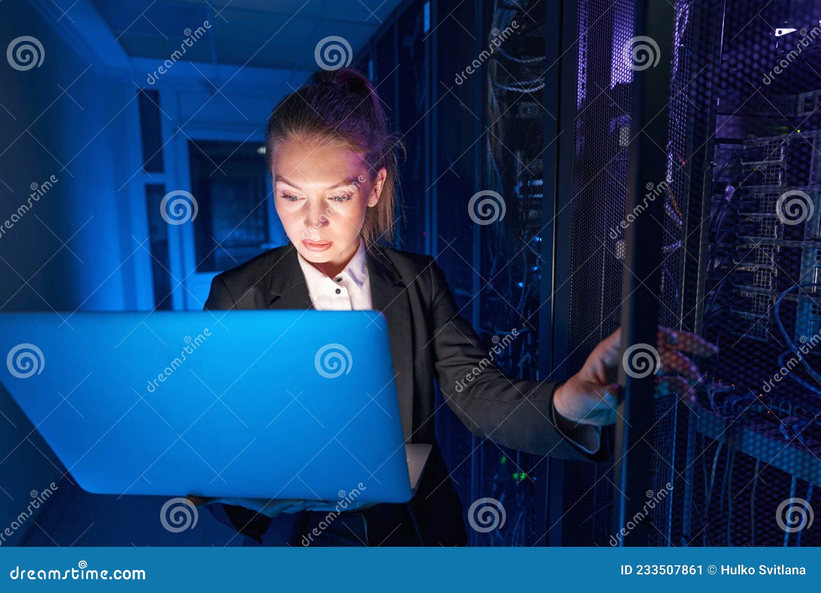 System Technician Using Laptop To Analyze Server Stock Image - Image of ...