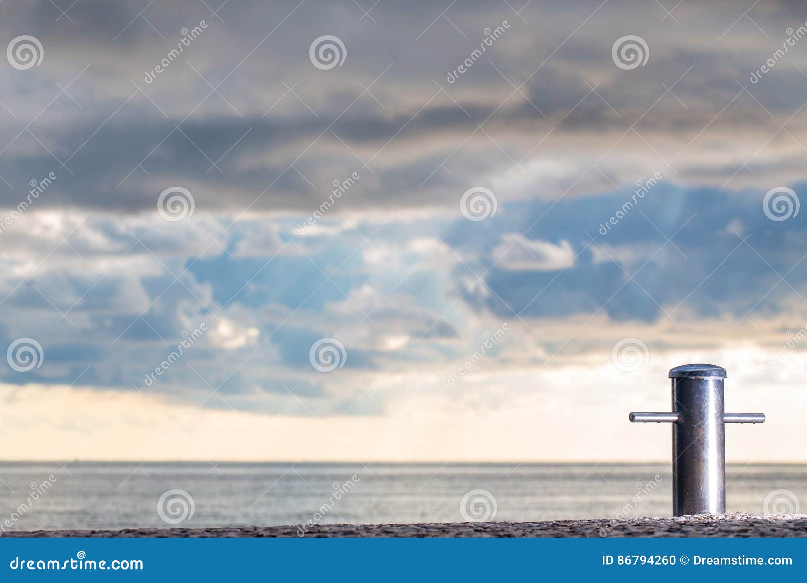 T-shaped Metal Cleat For Ships And Yachts At Sunset Dramatic Clouds ...