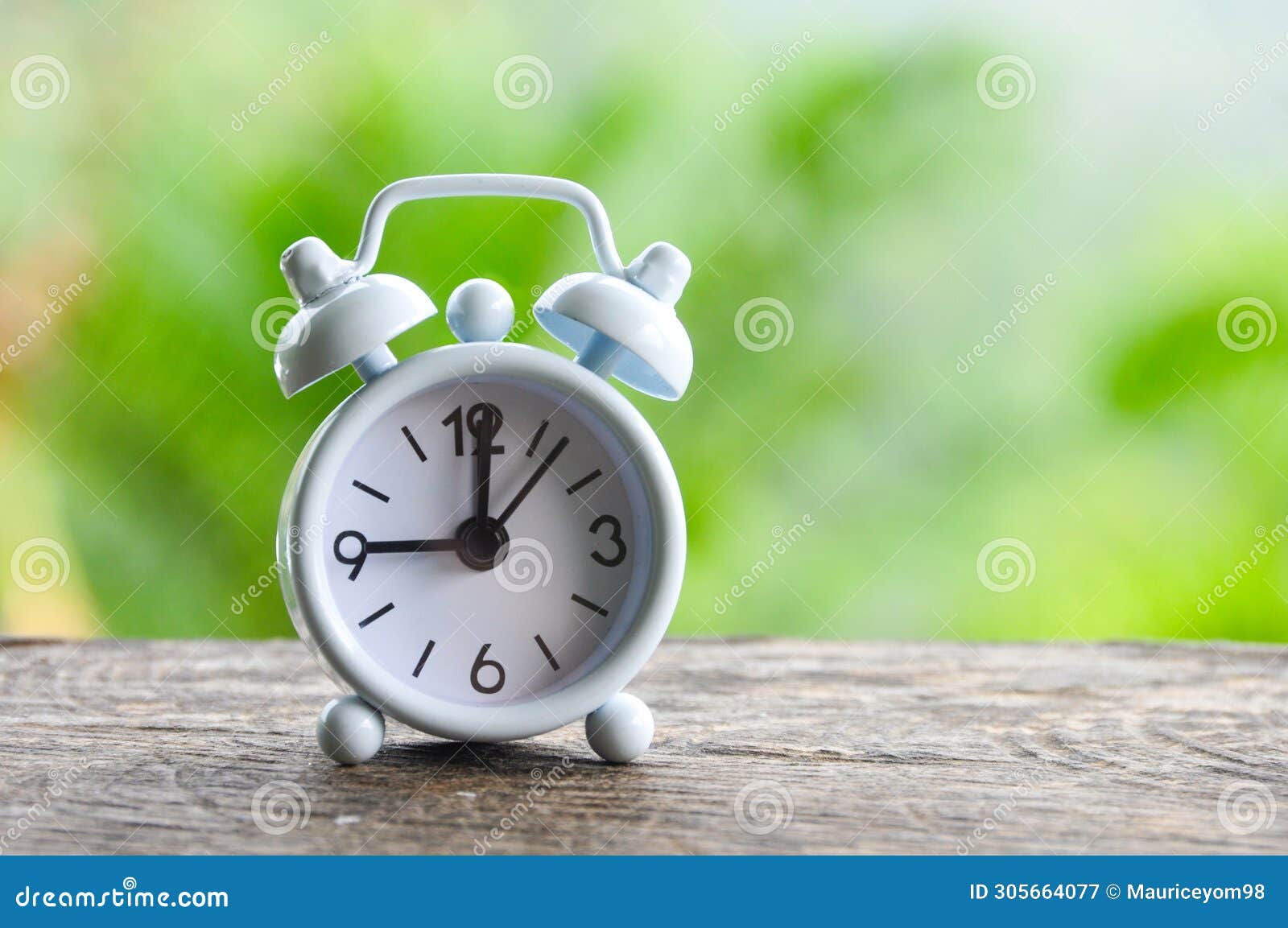 Table Alarm Clock Pointing at 9 am. Time Concept and Copy Space. Stock ...