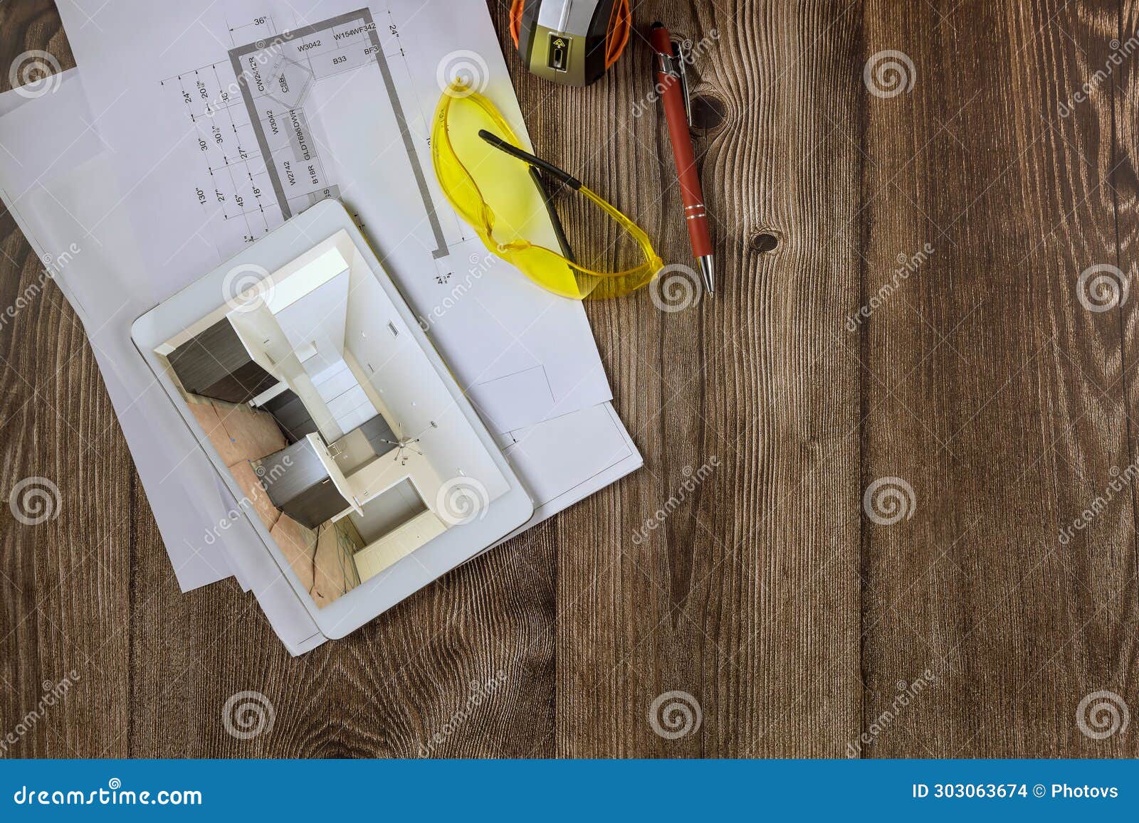 On Table, an Architectural Engineer is Designing a Blueprint for ...
