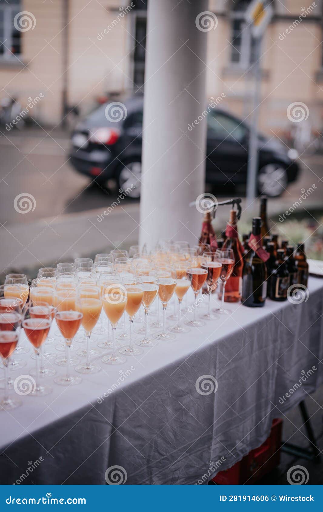 Table with an Array of Refreshments and Bottles of Alcohol Outdoors ...