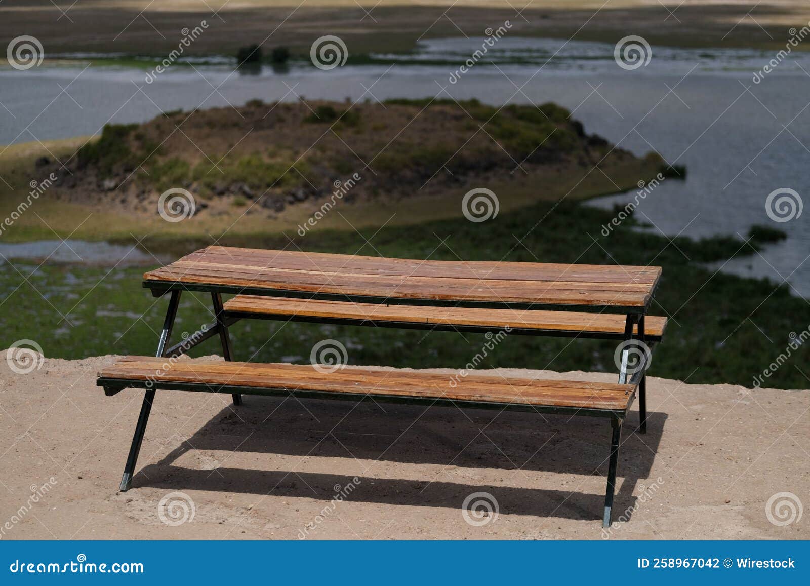 Table and Bench on the Edge of a Cliff Overlooking a River Stock Photo ...