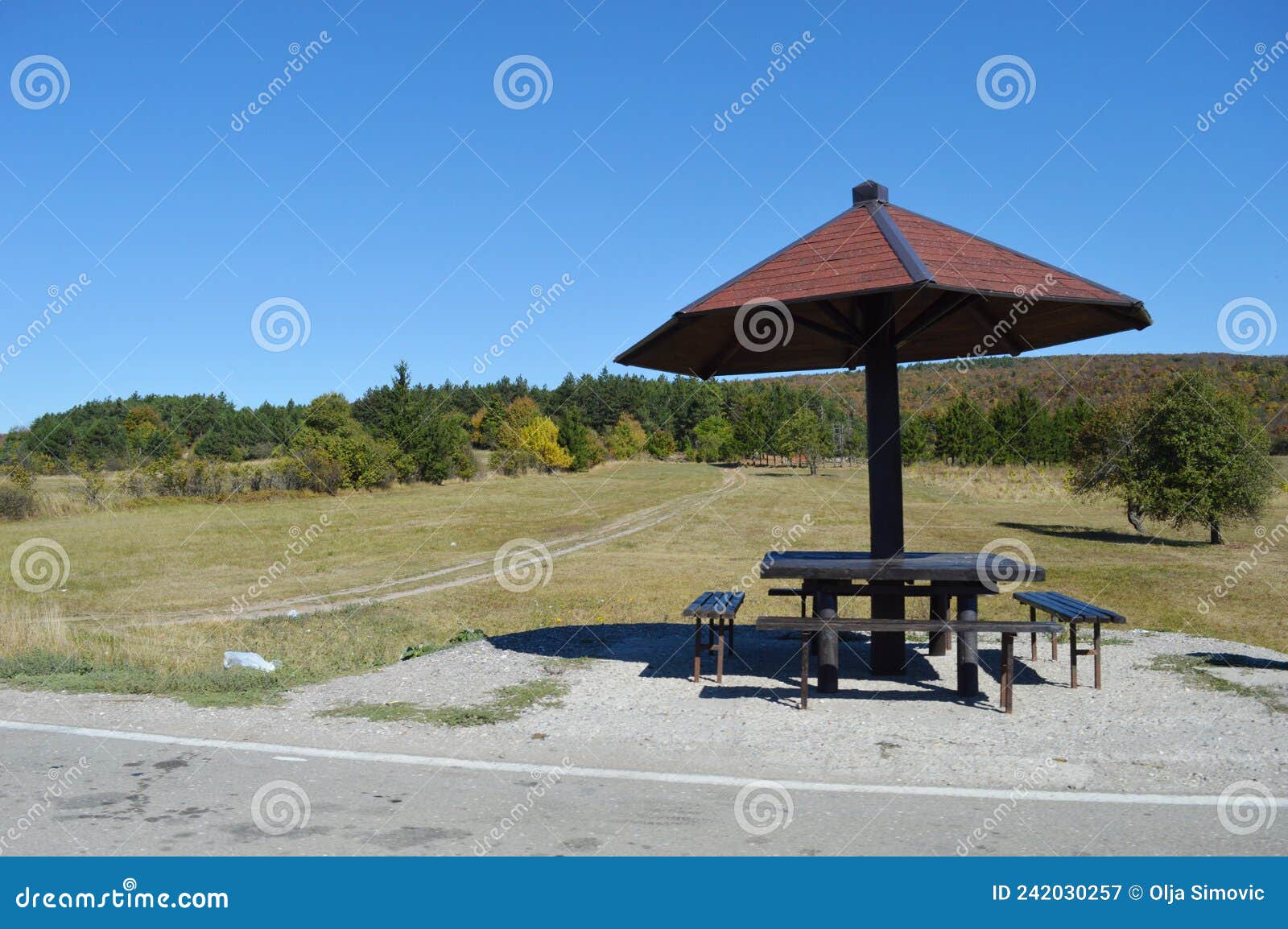 Table and Benches with a Canopy on the Road Stock Image - Image of road ...