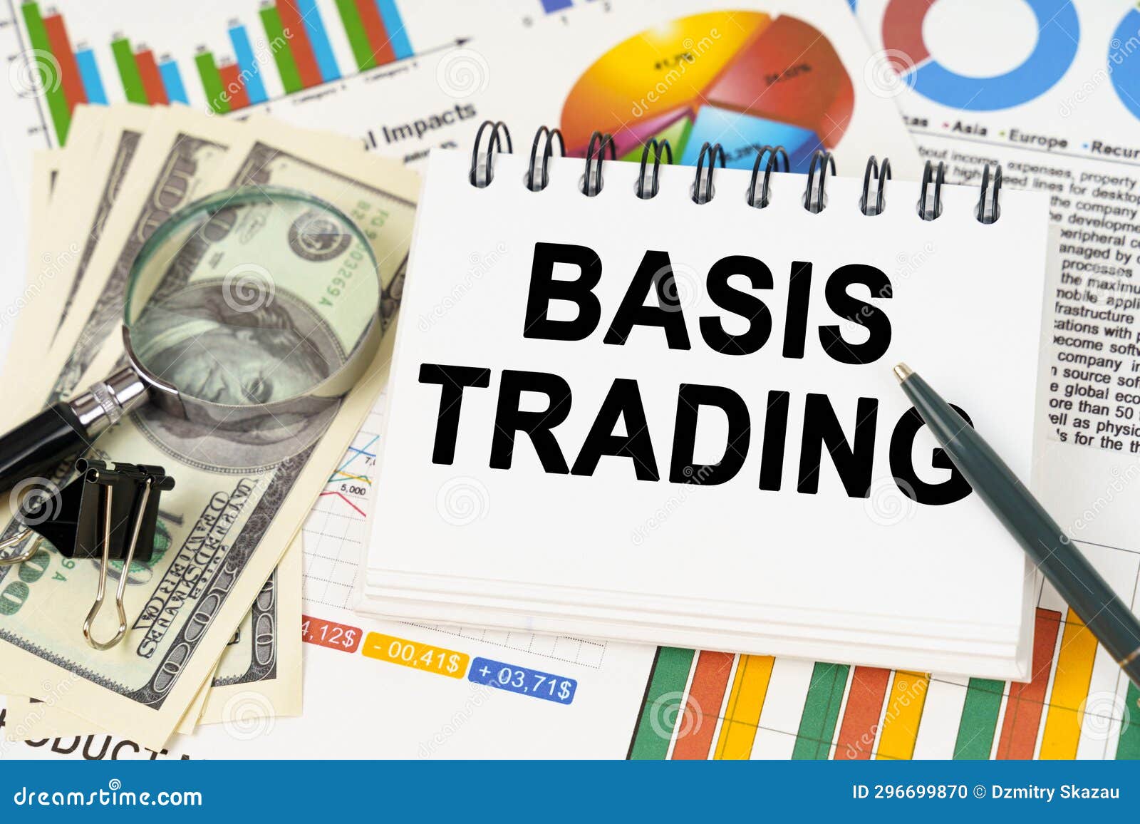 On the Table are Business Charts, Dollars and a Notepad with the ...