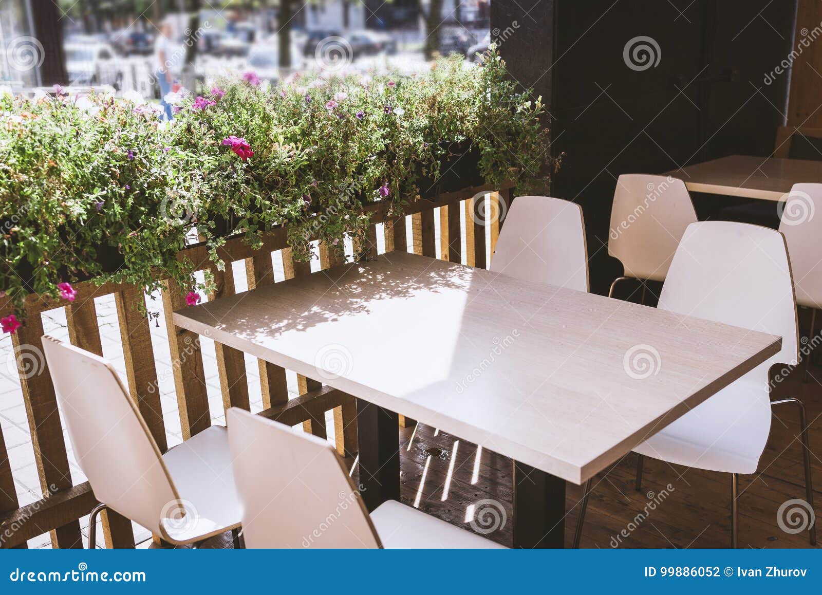 A Table in the Cafe and Flowers on the Veranda Stock Photo - Image of ...