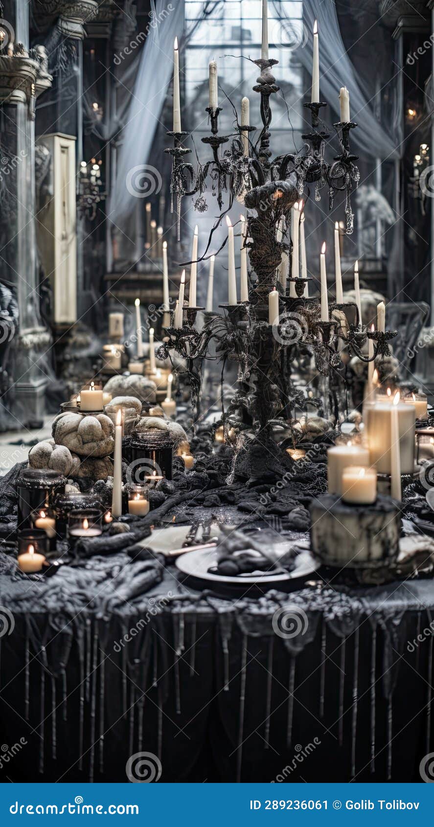 A Gothic Table Setting with Candles and Skulls Stock Image - Image of ...