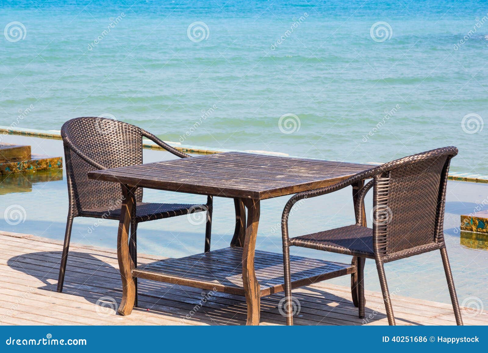 Table chair beside sea stock photo. Image of recreation - 40251686
