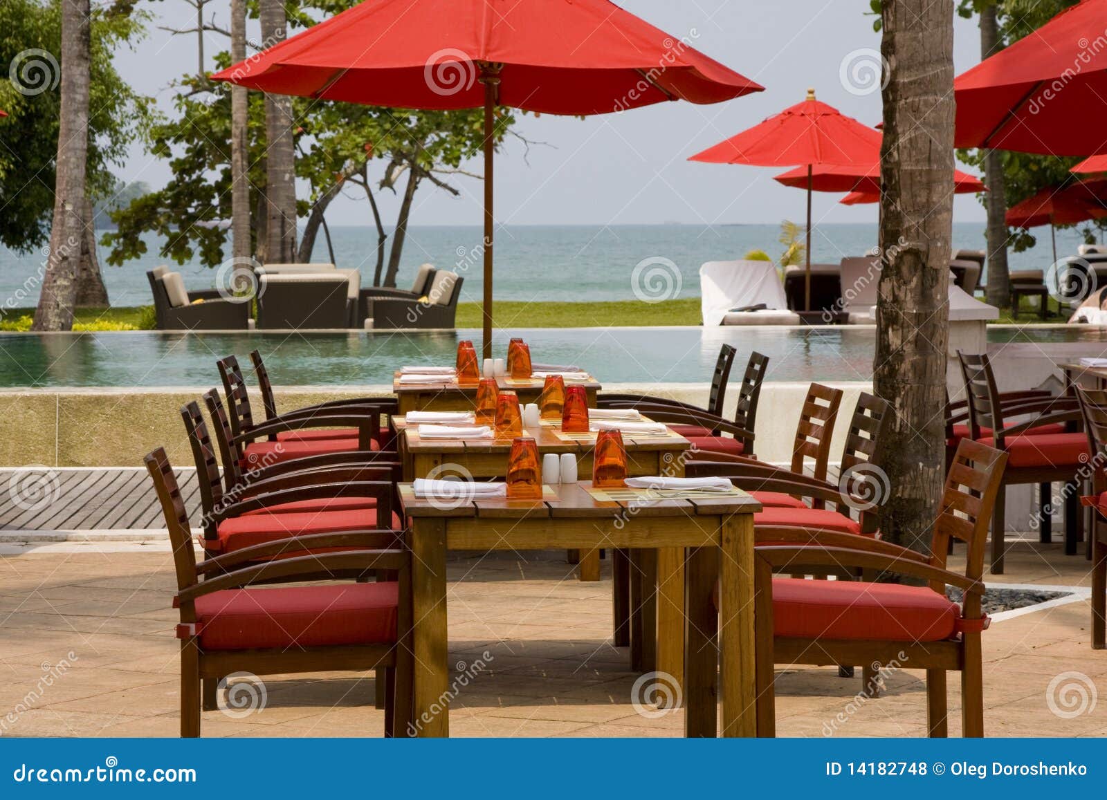 Table and chairs on beach stock photo. Image of dinner - 14182748