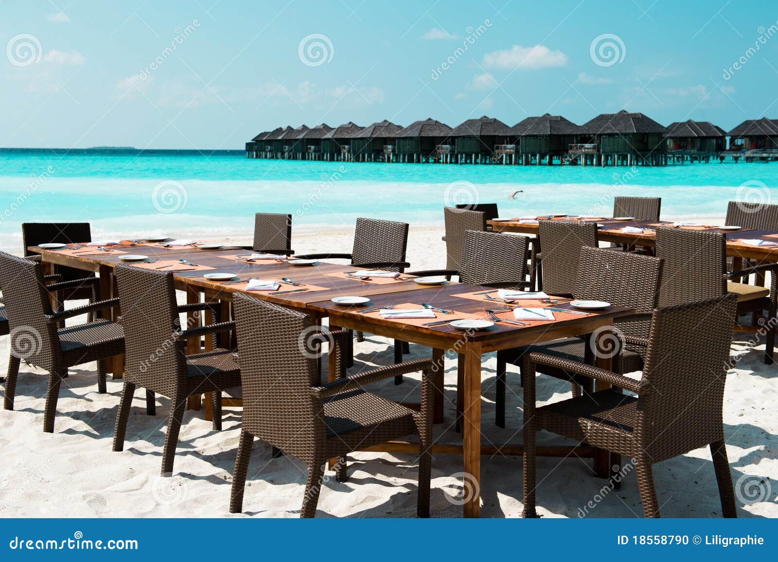 Table and Chairs on Exotic Beach Stock Photo - Image of ocean, shadow ...