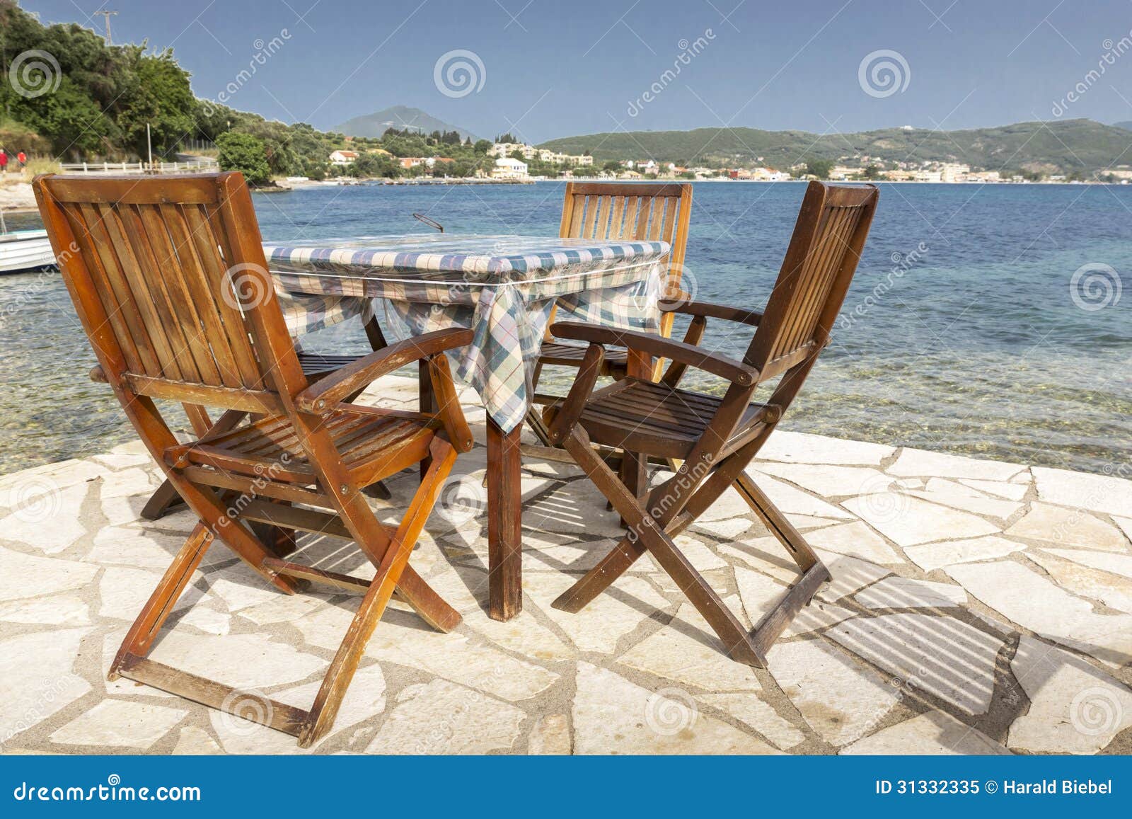 Table and chairs in Greece stock image. Image of island - 31332335