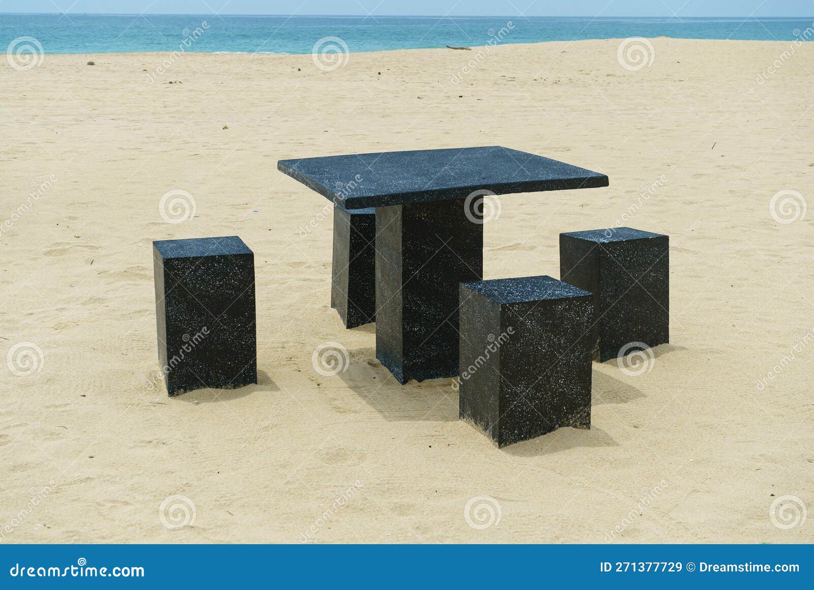 A Table and Chairs Made of Stone Stands on Seashore Stock Image - Image ...