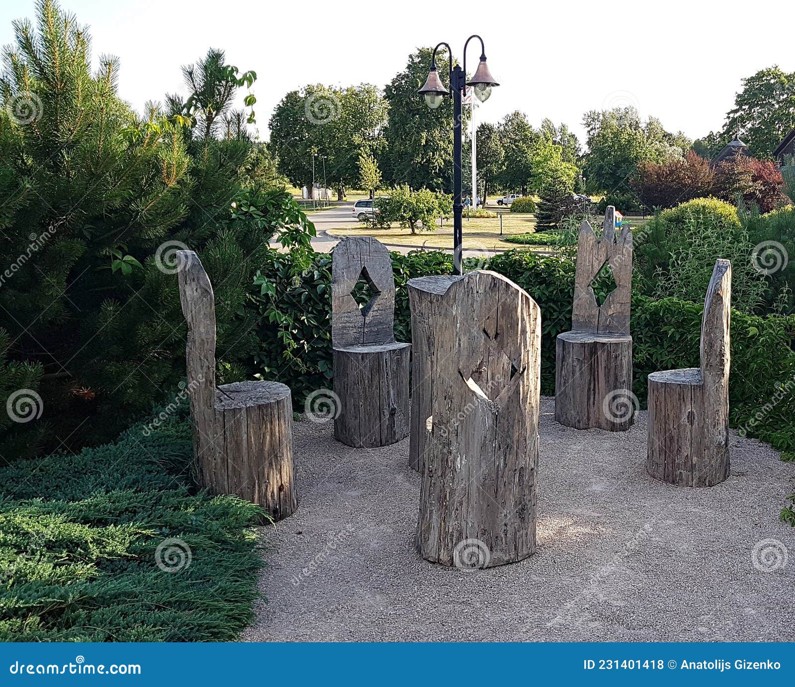 Table and Chairs Made of a Thick Tree Trunk are Installed in the Park ...