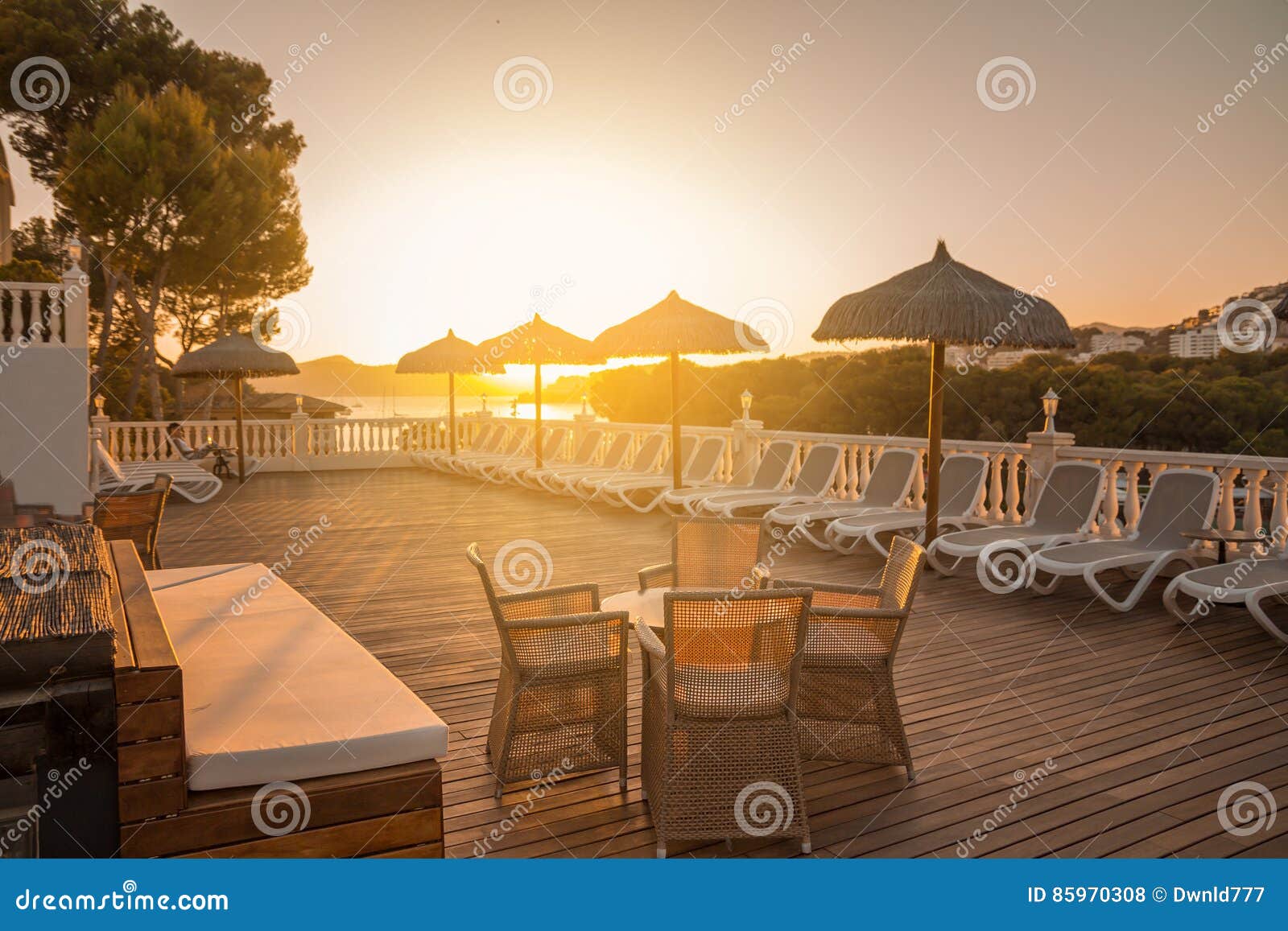 Table and Chairs in Sunset on Terrace of Holiday Resort Stock Photo ...