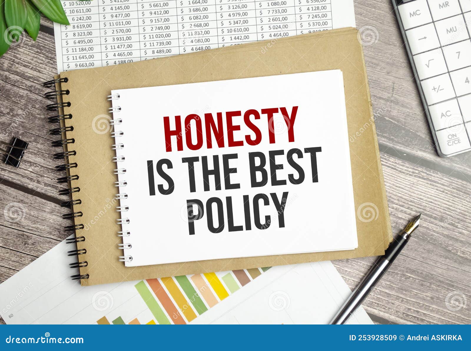 On the Table Charts, Calculator and Notebook with the Inscription ...