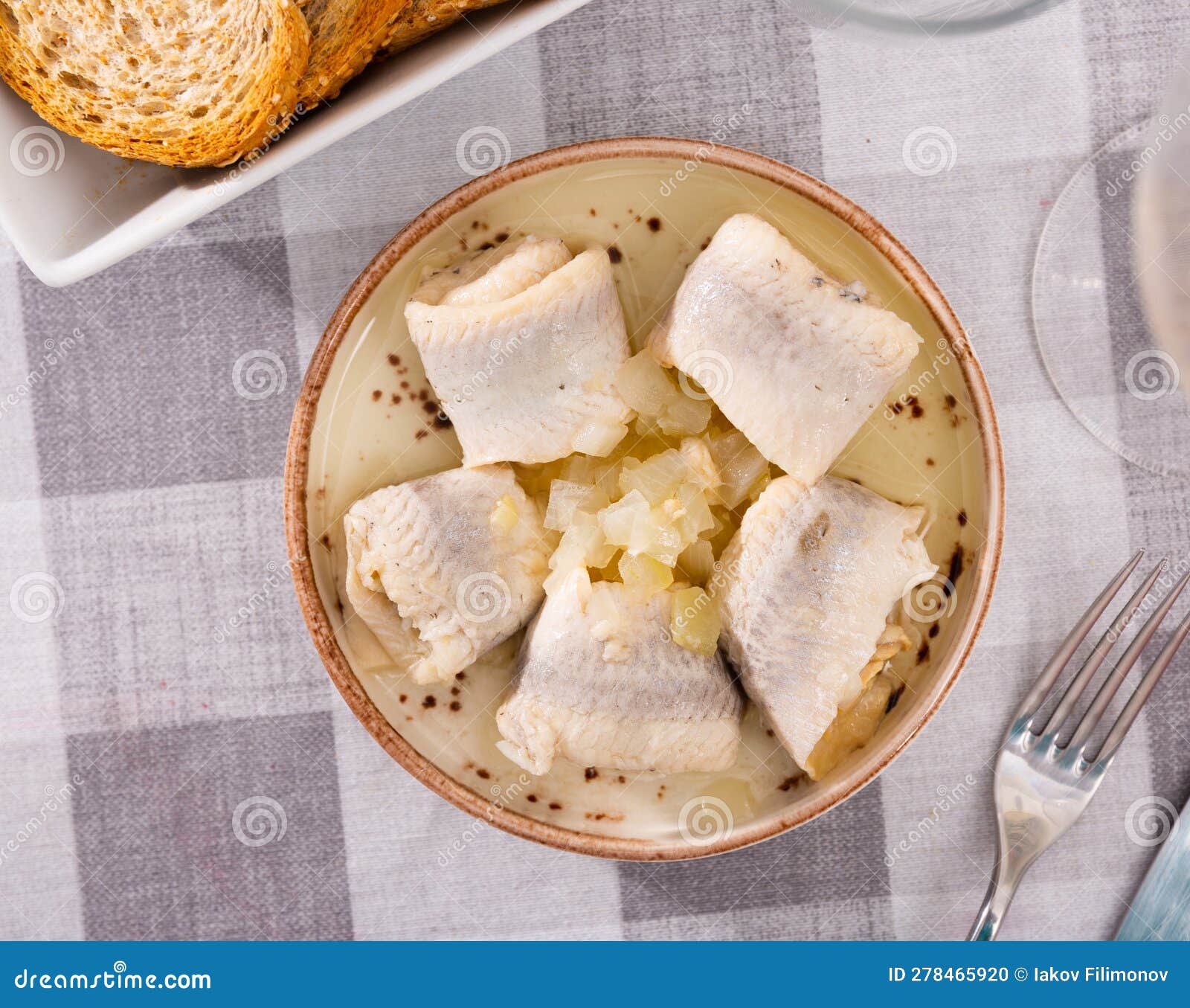 On Checkered Tablecloth Plate with Appetizer - Rolls of Salted Atlantic ...