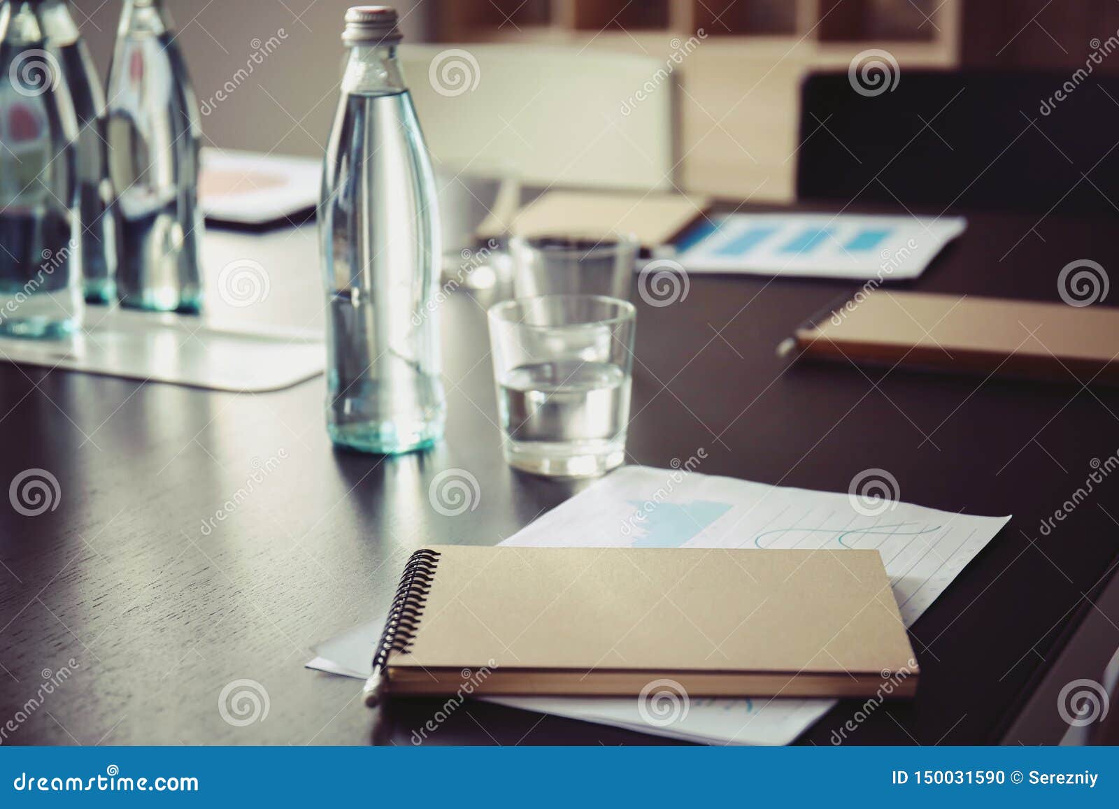 Table with Documents and Bottle of Water Prepared for Business Meeting ...
