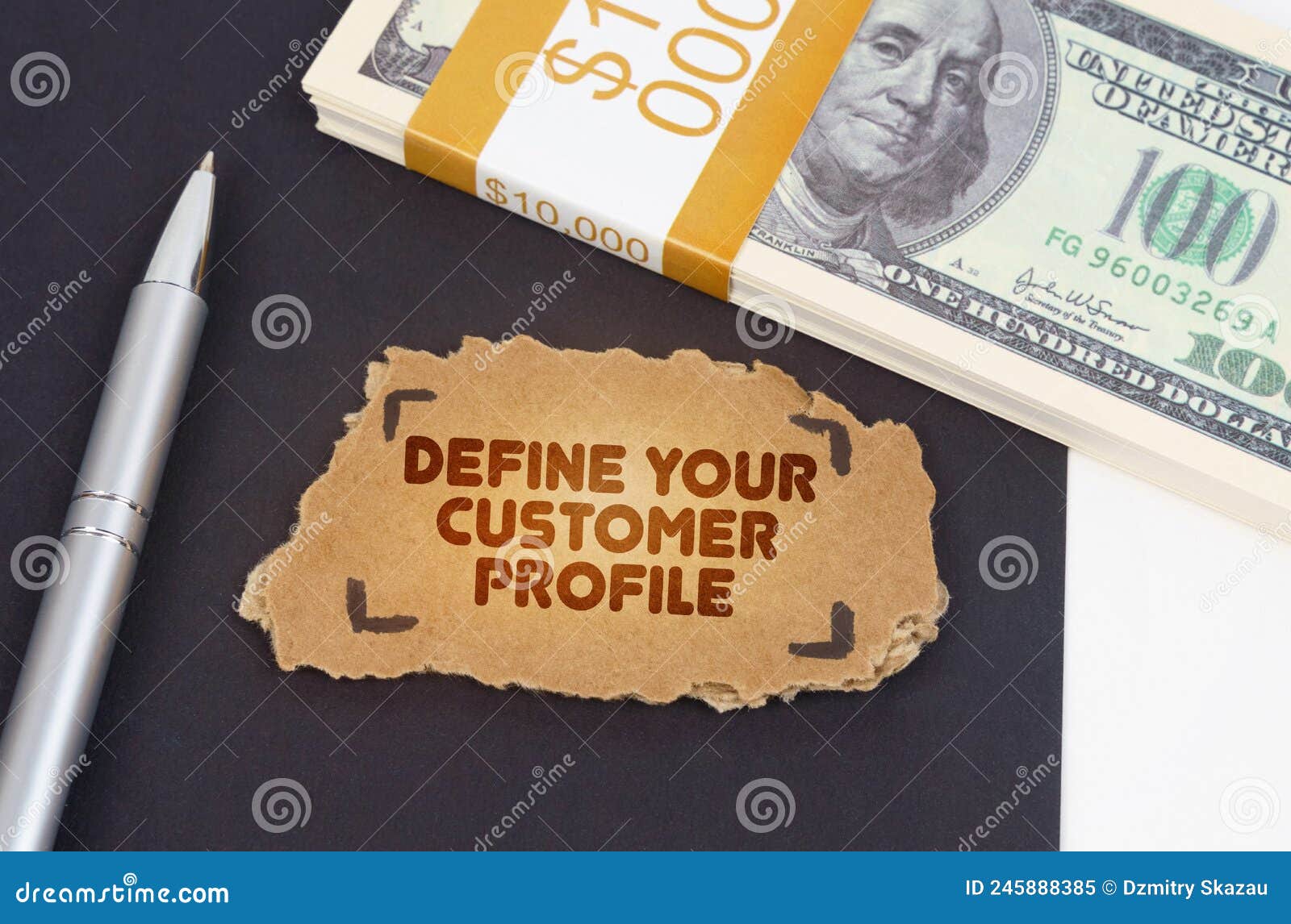 On the Table are Dollars, a Pen and a Cardboard Sign with the ... On the Table are Dollars, a Pen and a Cardboard Sign with the ...