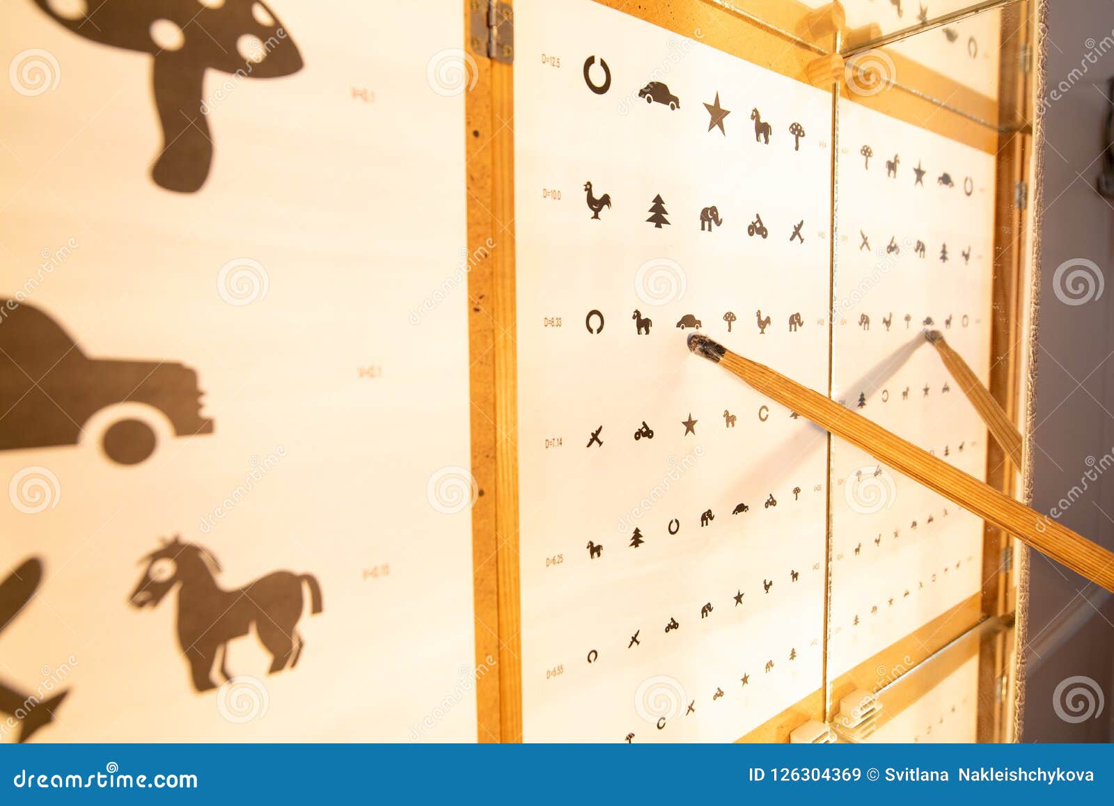 A Table for Eye Examination with a Yellow Frame Stock Image - Image of ...