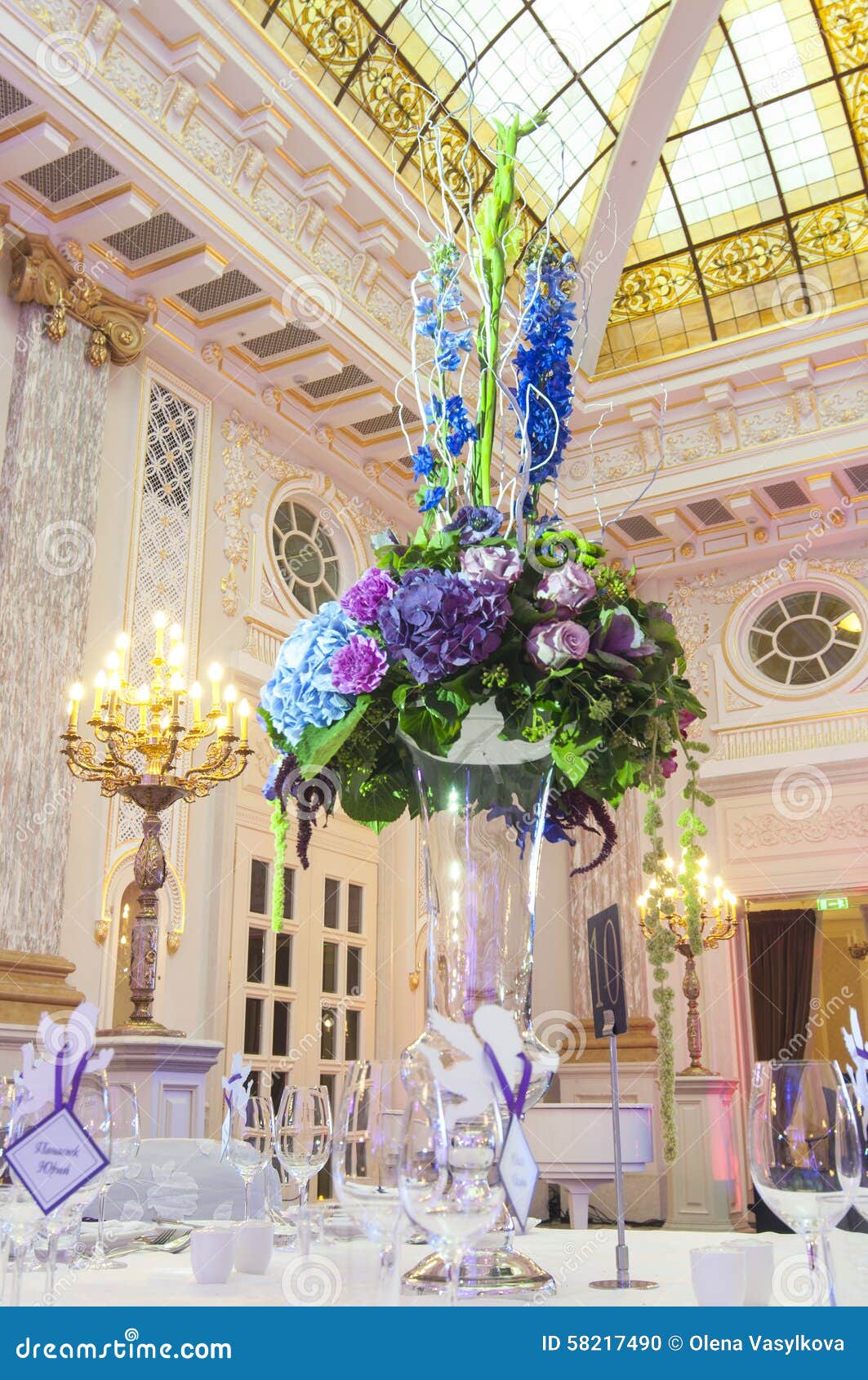 Table with Flowers in Banquet Hall Stock Photo - Image of dishes ...