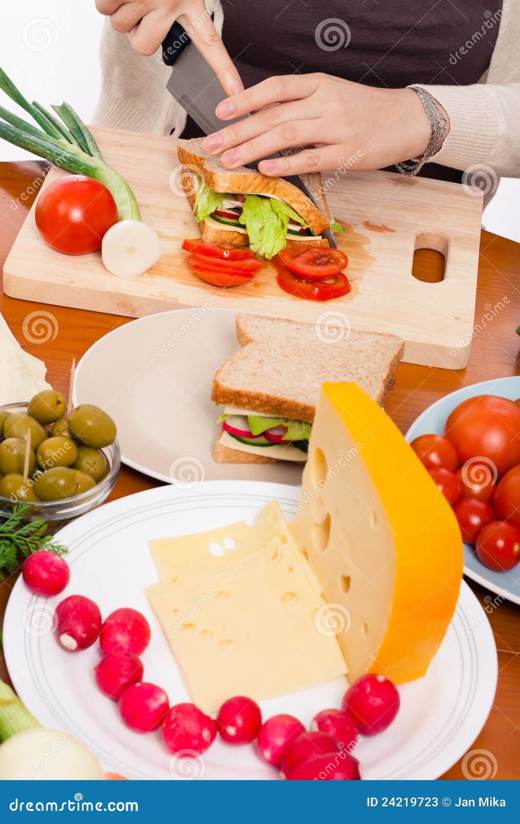 Table with Food and Woman Halving Sandwich Stock Image - Image of food ...