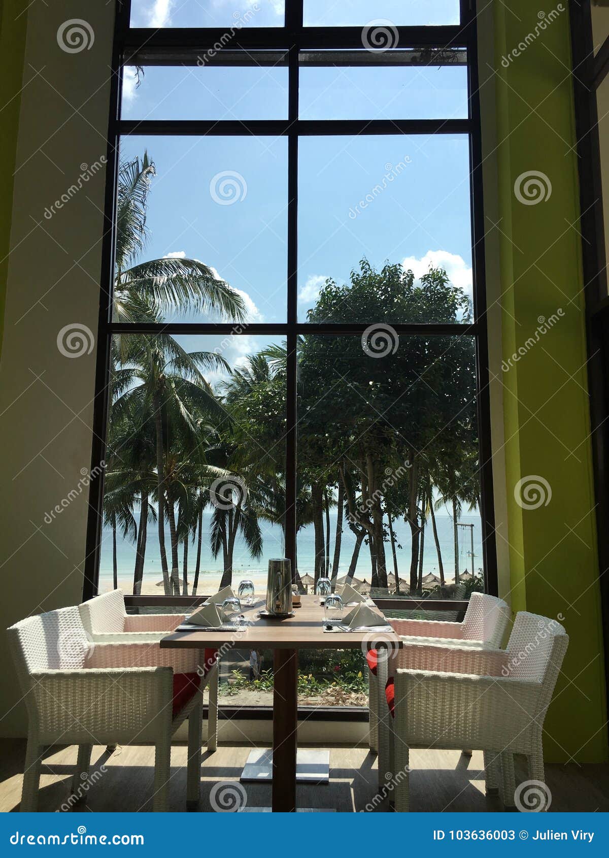 Table in Front of a Window with Beach View Stock Image - Image of ...