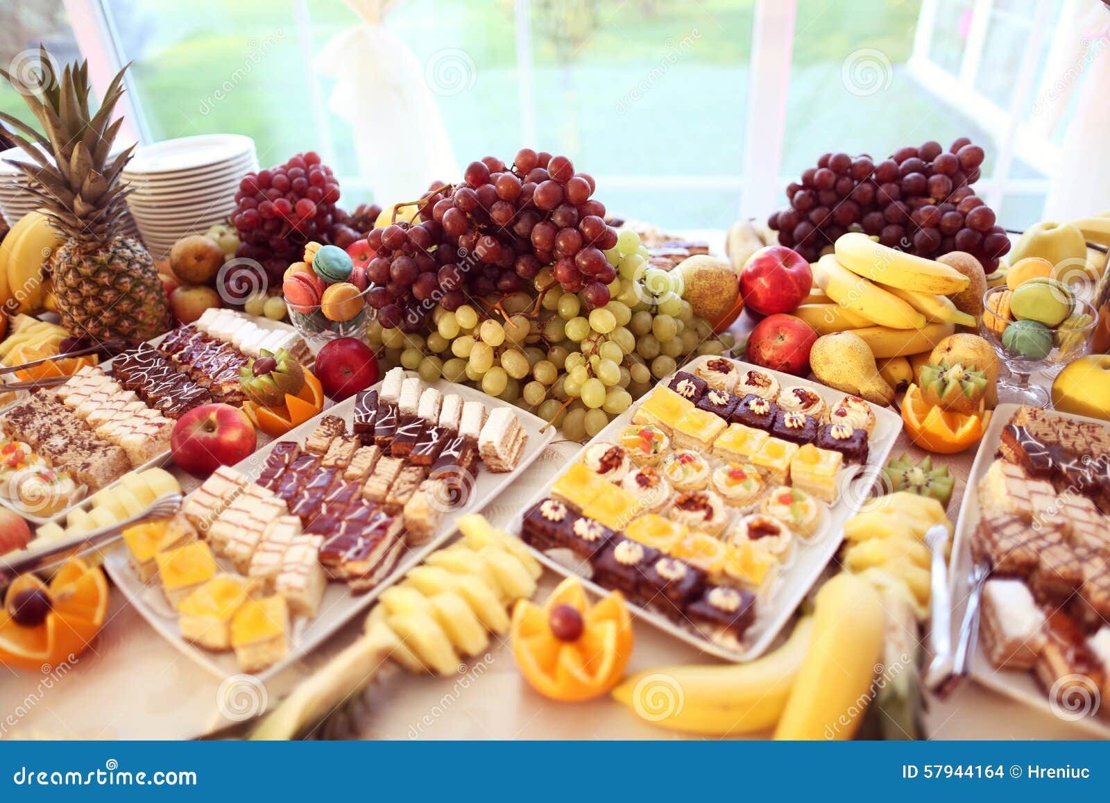 Table Full of Fruits and Small Cakes Stock Photo - Image of chocolate ...