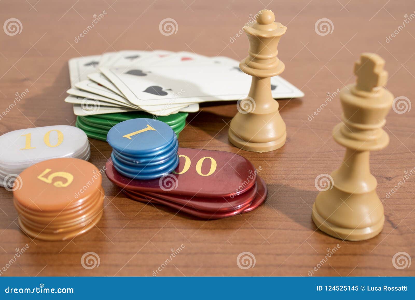 Table Games Cards, Chess and Casino Chips on a Wood Table Stock Image ...