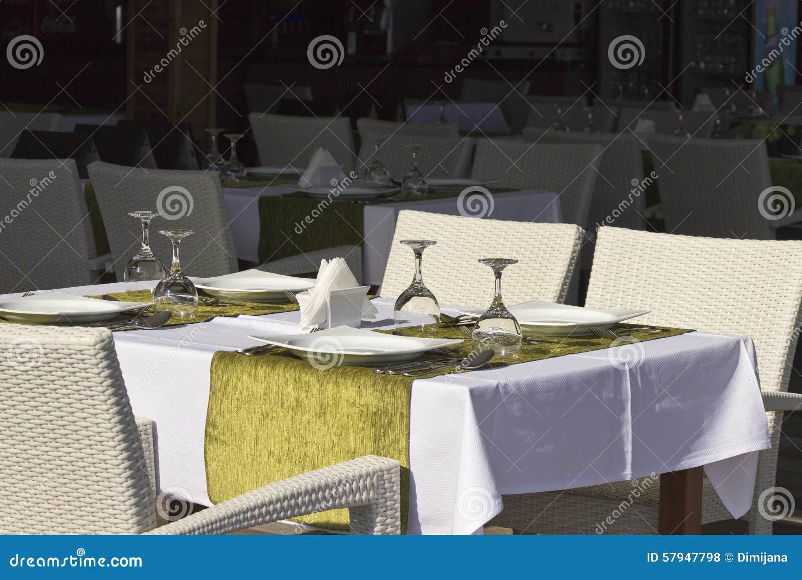 Table laid for dinner stock photo. Image of tablecloth - 57947798