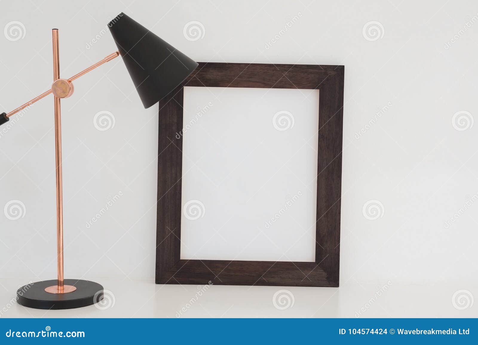 Table Lamp and Blank Picture Frame on Table Stock Photo - Image of ...