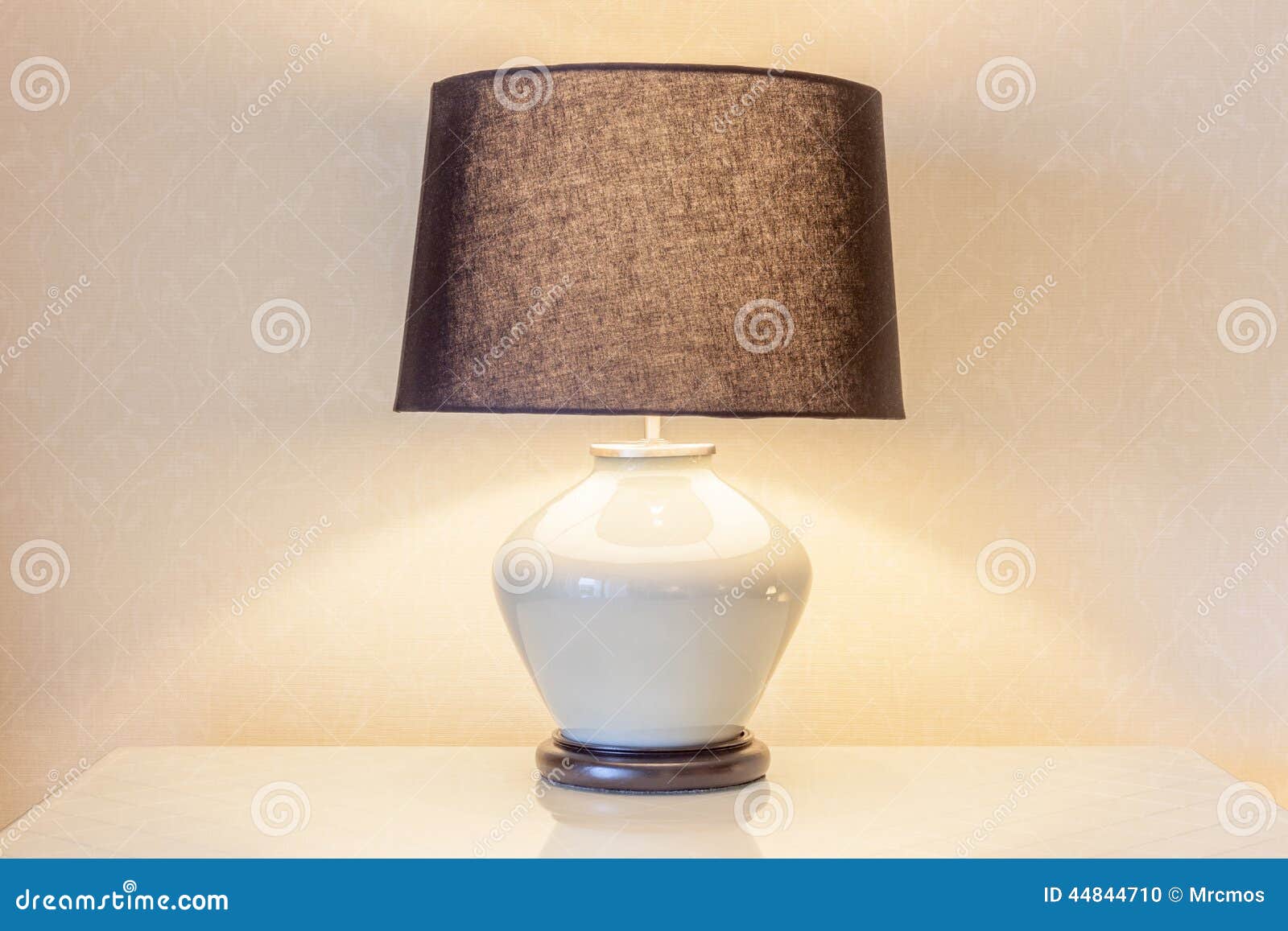 Table Lamp and Its Shadow on Wallpaper in the Bedroom Stock Photo ...