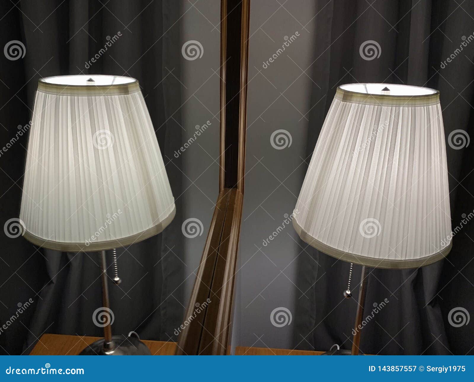 Table Lamp with Lampshade on the Table in Front of a Mirror Stock Image ...