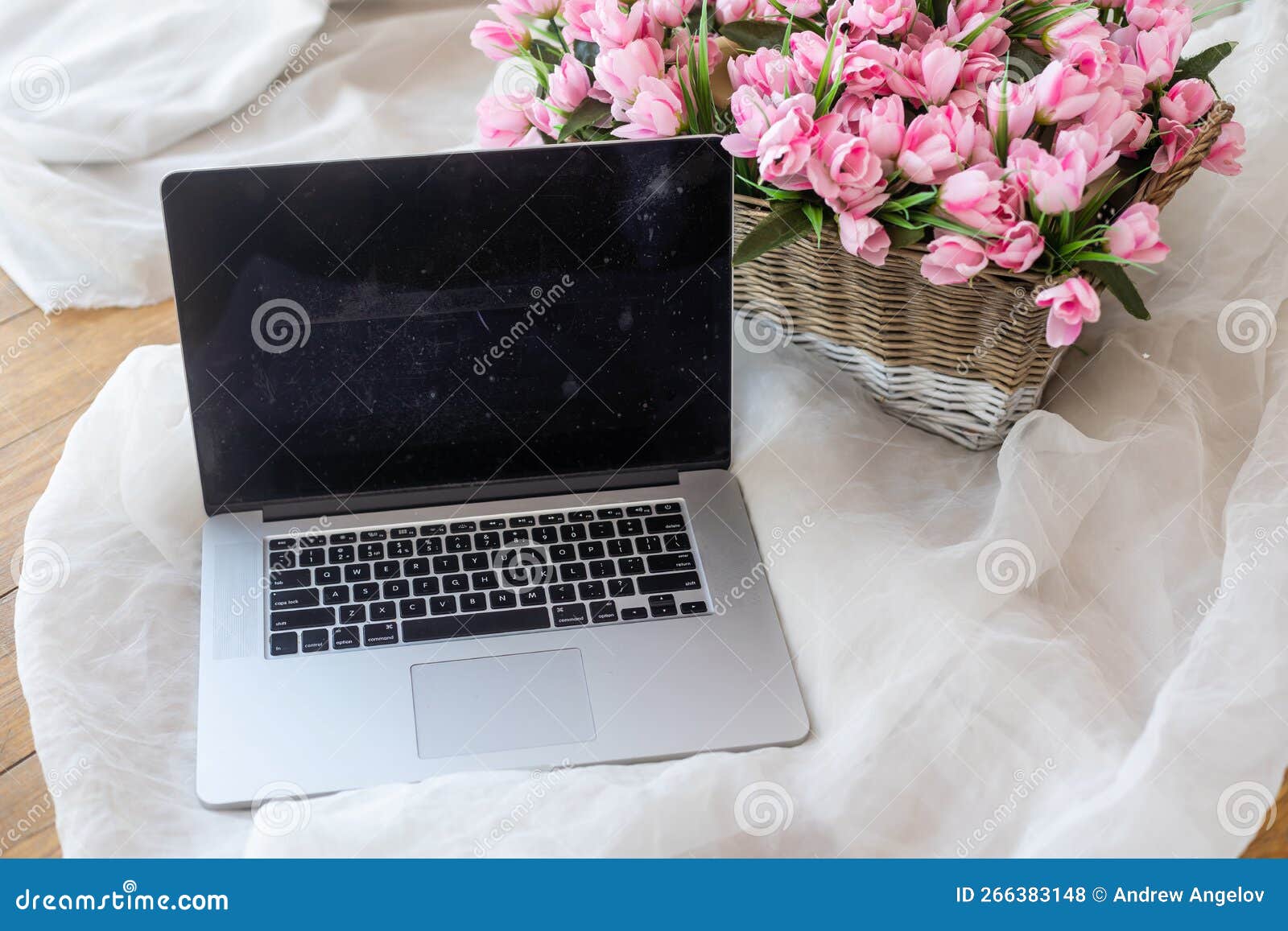 Table with Laptop and Flowers in a Basket Editorial Stock Photo - Image ...