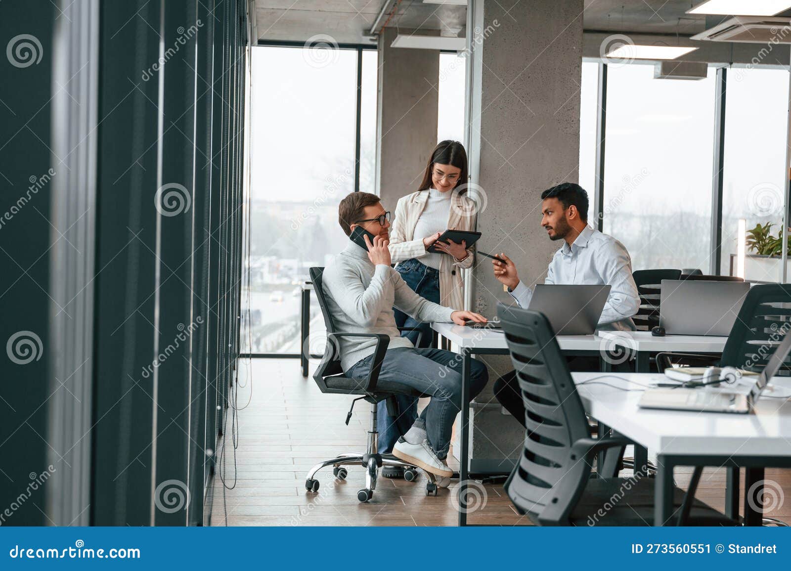 By the Table with Laptop. Men and Woman are Working in the Office ...