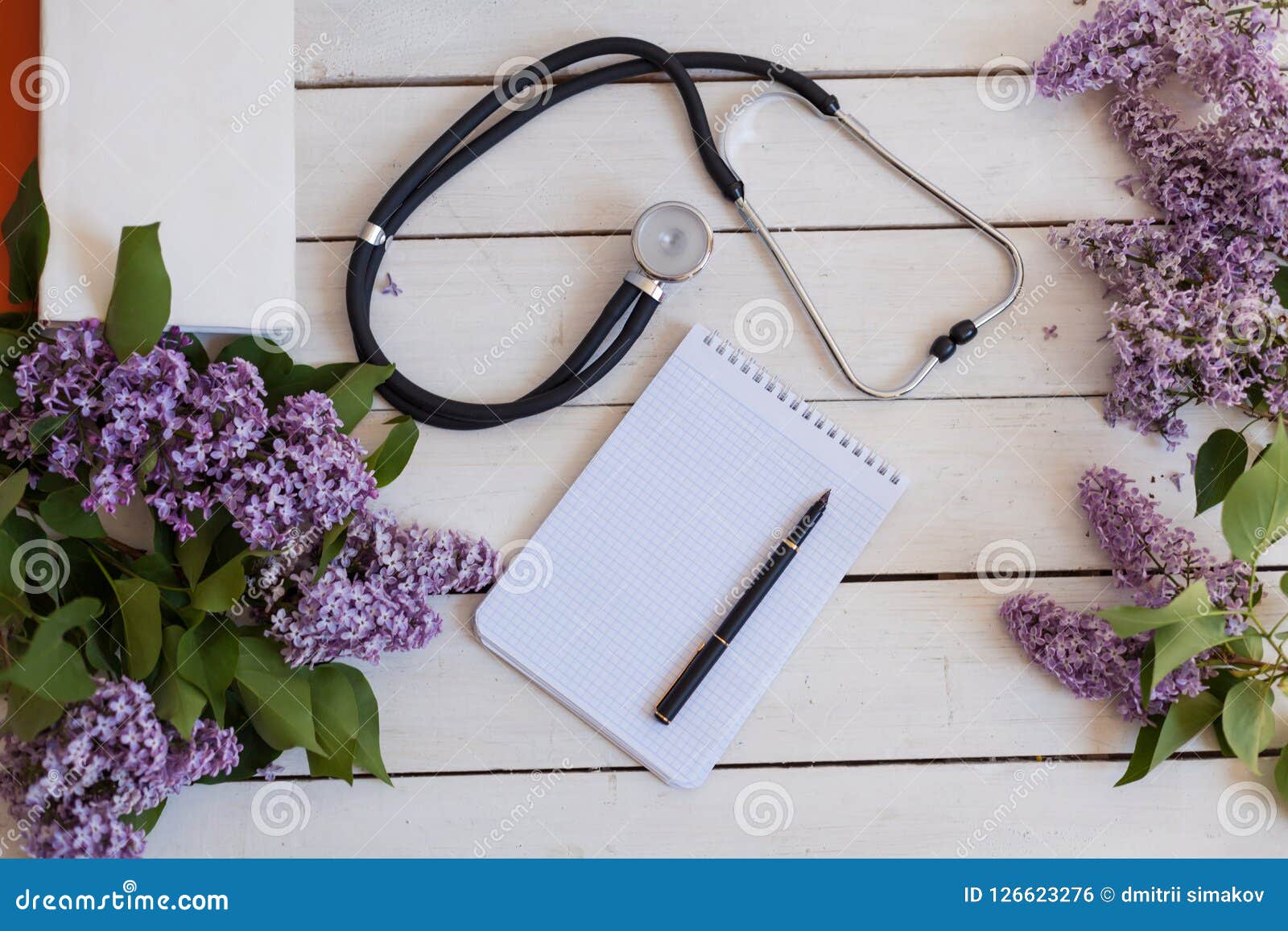 On the Table Lay a Lilac, Stethoscope, Notebook Stock Photo - Image of ...