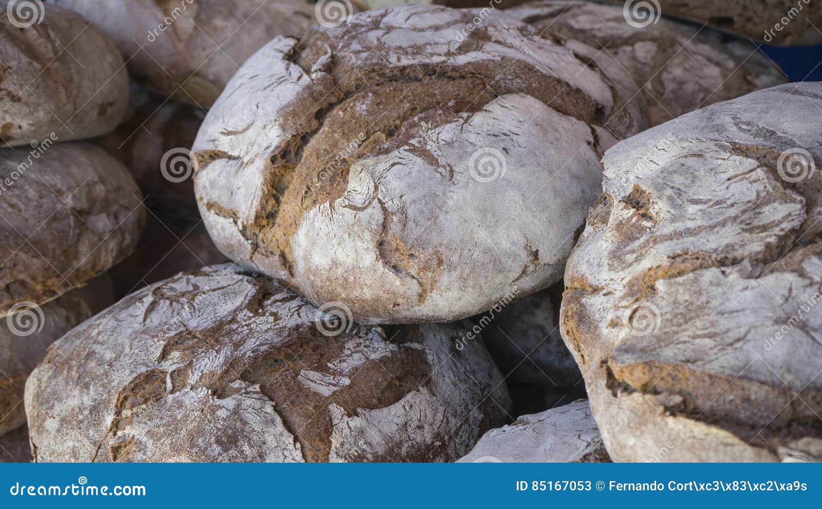Table with Loaves of Bread Made by Hand at a Medieval Fair in Sp Stock ...