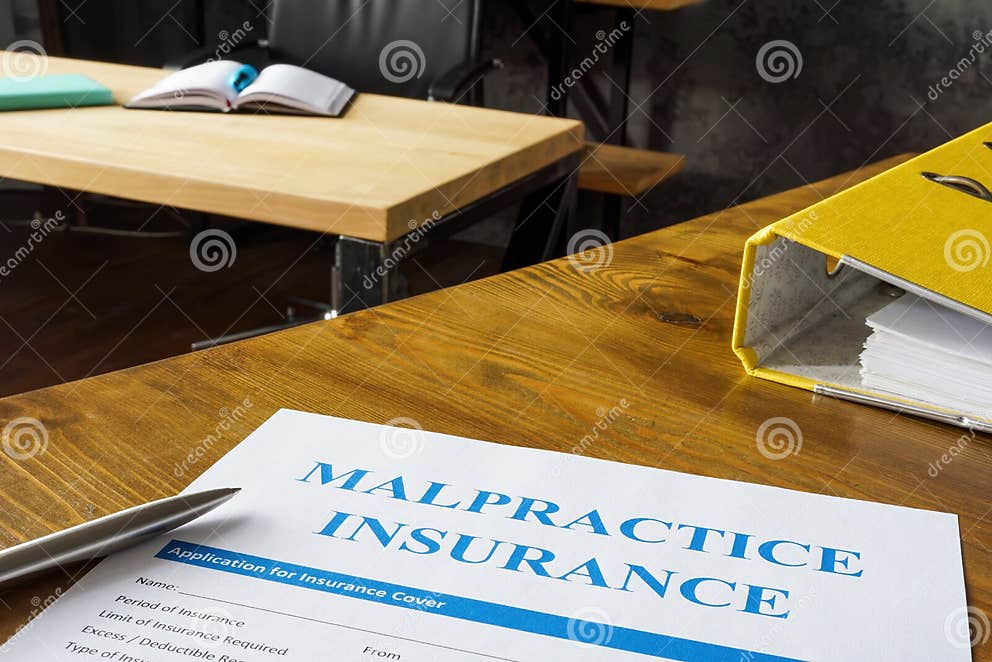 Table with Malpractice Insurance Application on it. Stock Photo - Image ...