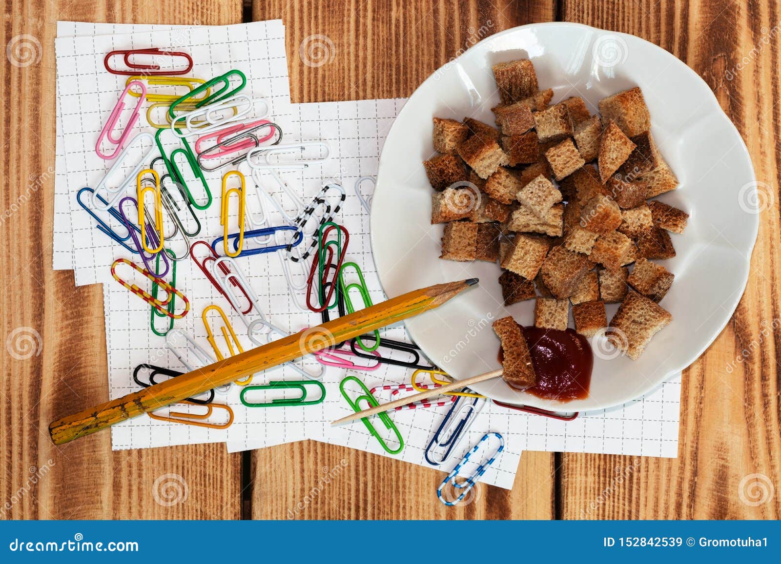 On the Table in a Mess of Scattered Multi-colored Clips To Attach Notes ...