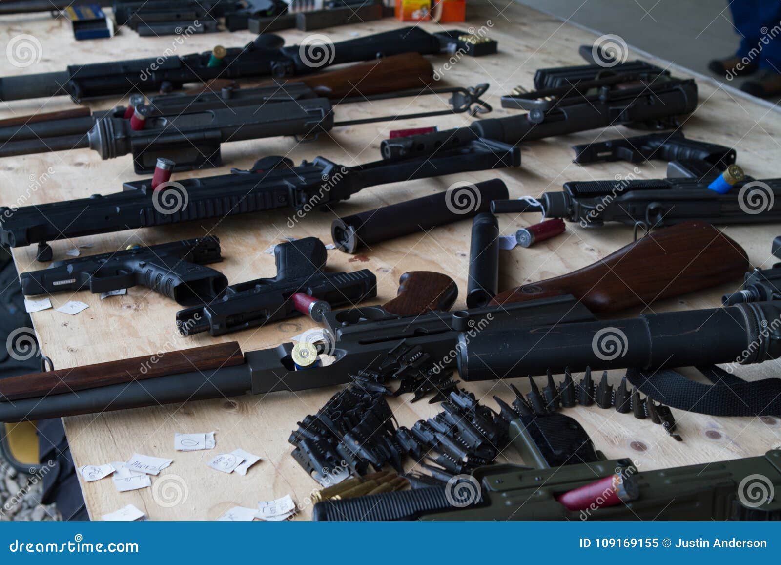 Table with Numerous Firearms Stock Image - Image of numerous, guns ...
