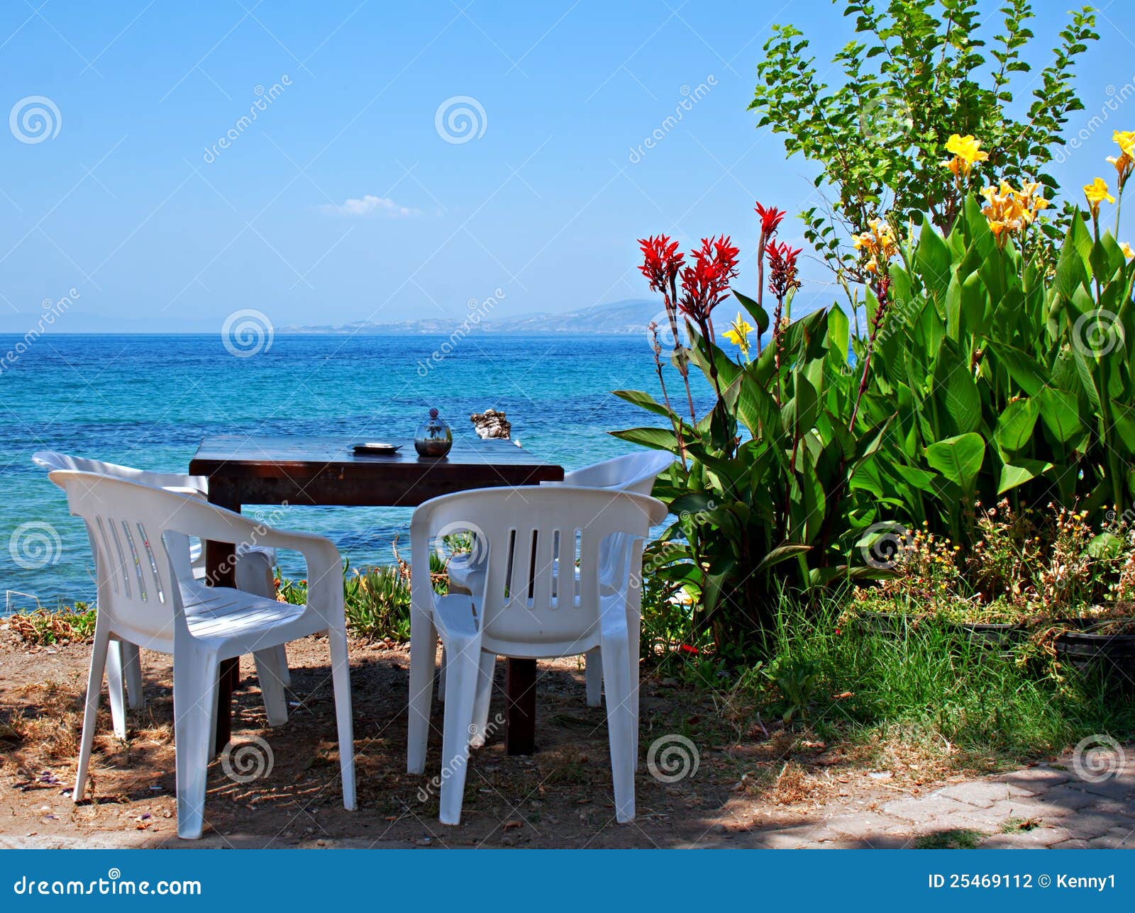 Table overlooking the sea stock photo. Image of garden - 25469112